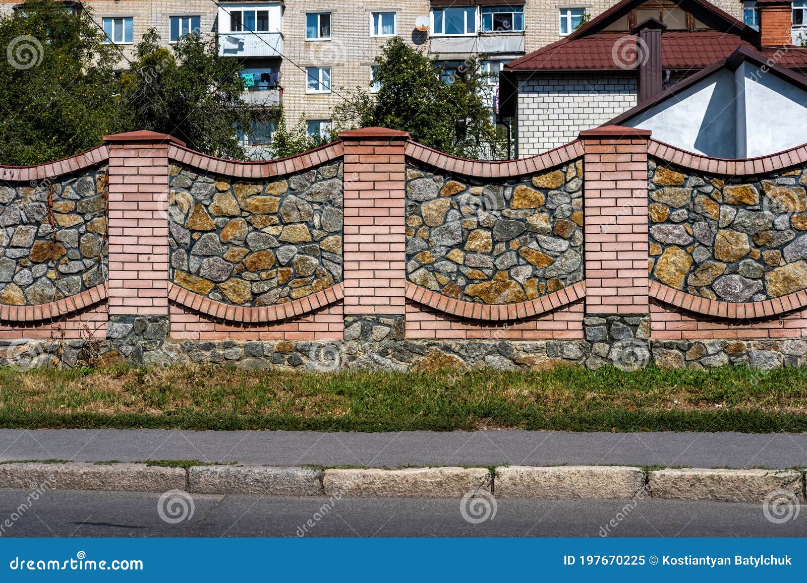 Stone and Brick Fence. Decorative Cracked Real Stone Wall Surface with ...
