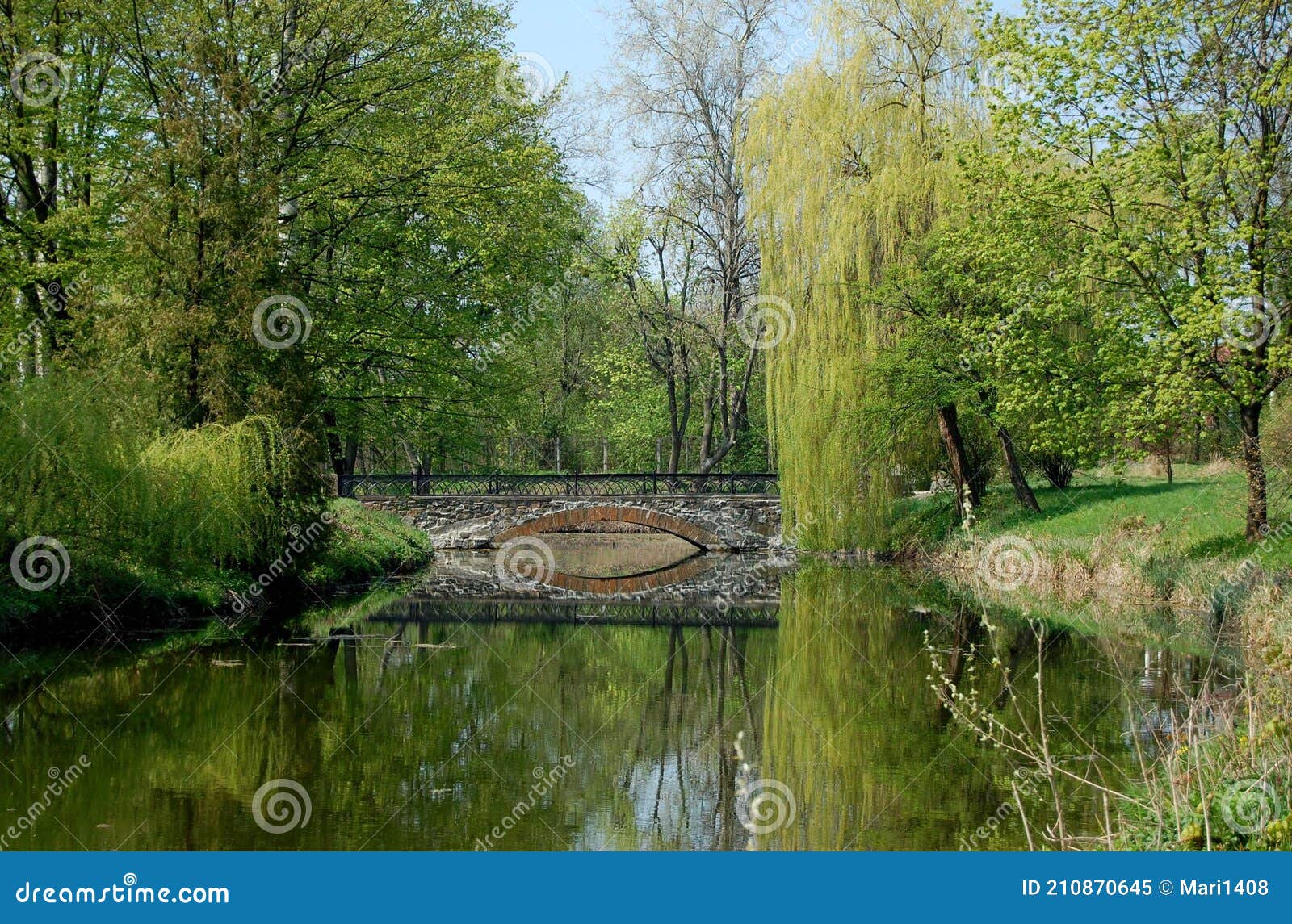 Stone Bridge Across the Lake with a Reflection on the Shores Stock ...