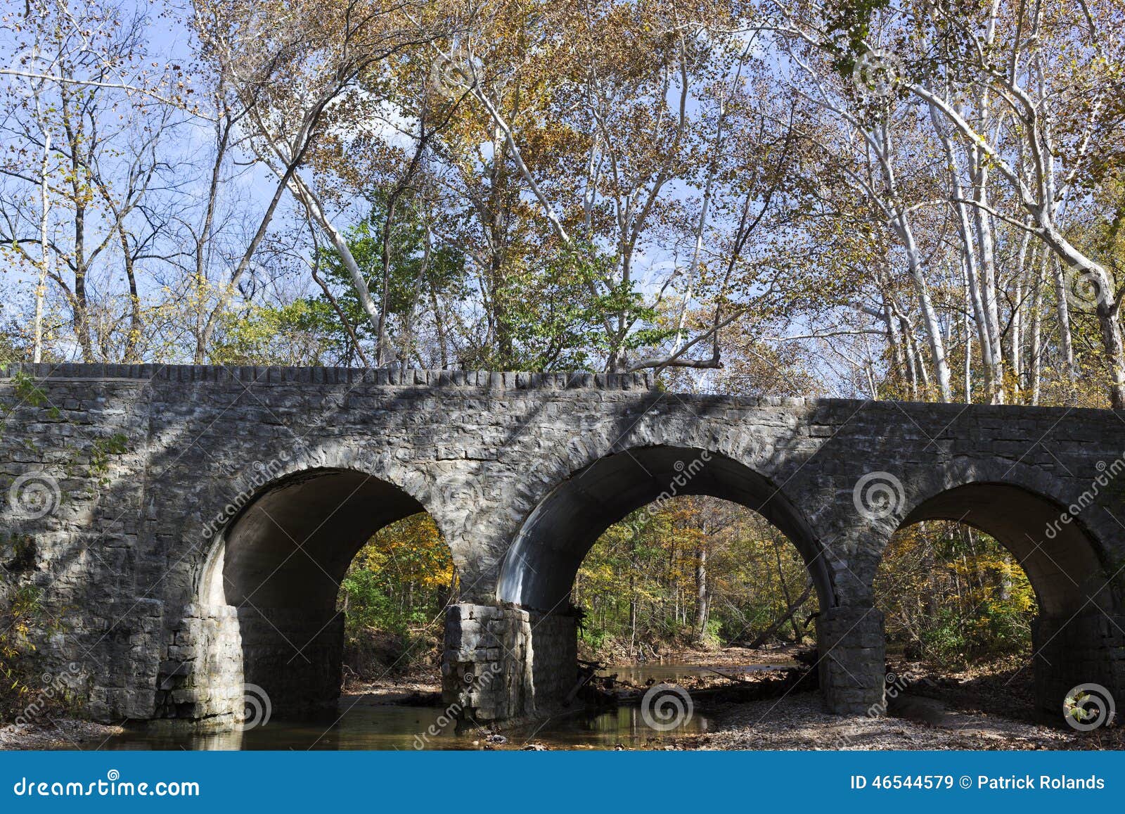 Stone bridge in fall stock image. Image of architecture - 46544579