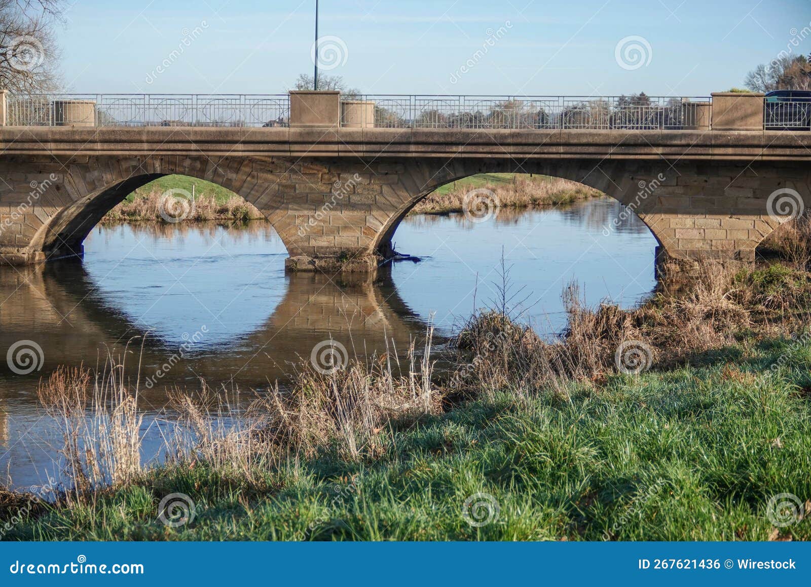 Stone Bridge with Multiple Arches Over a River Under the Blue Sky Stock ...