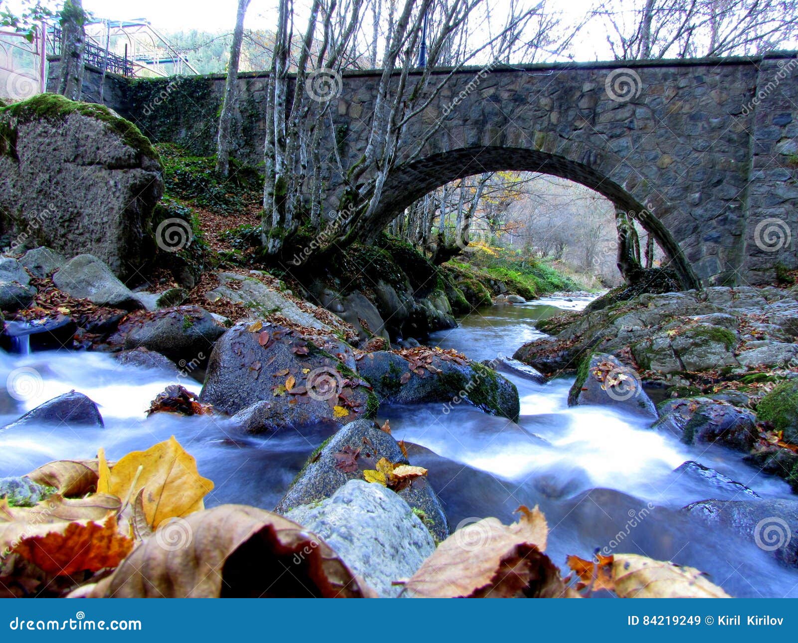 Stone bridge stock image. Image of leaves, water, landscape - 84219249