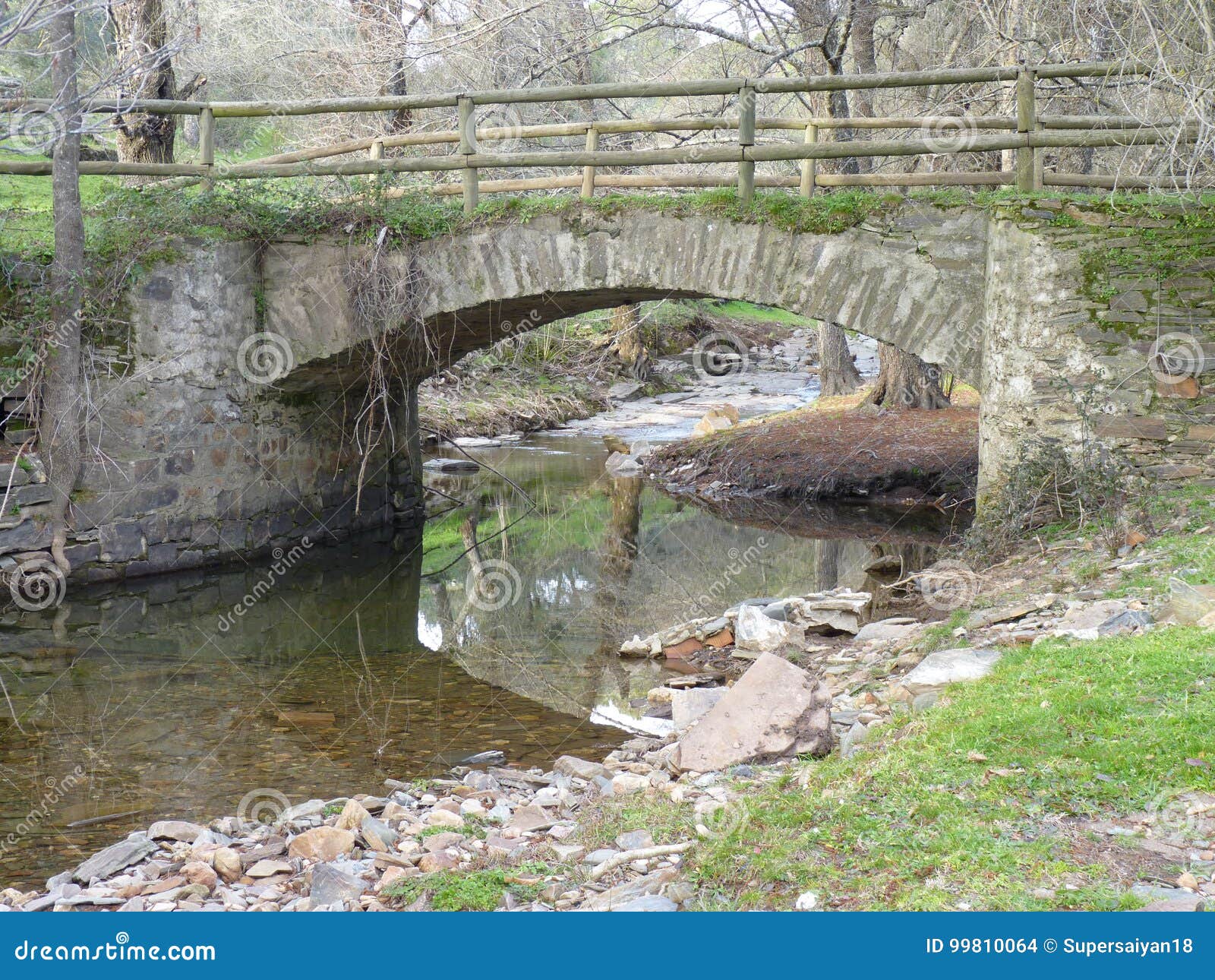 Stone bridge over river stock photo. Image of historic - 99810064