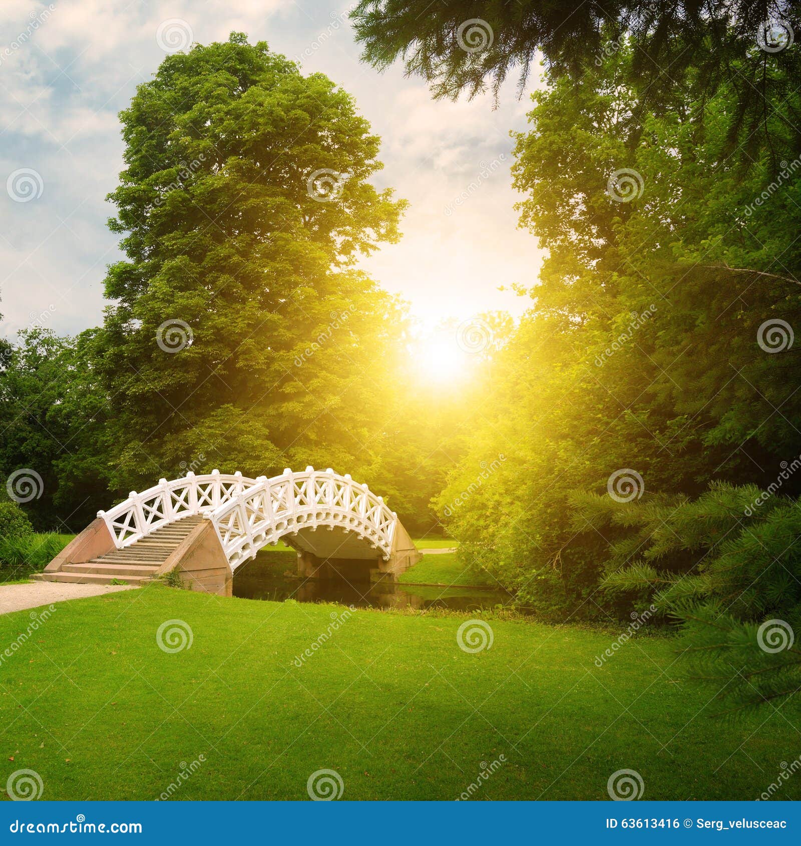 Stone bridge over stream stock photo. Image of river - 63613416
