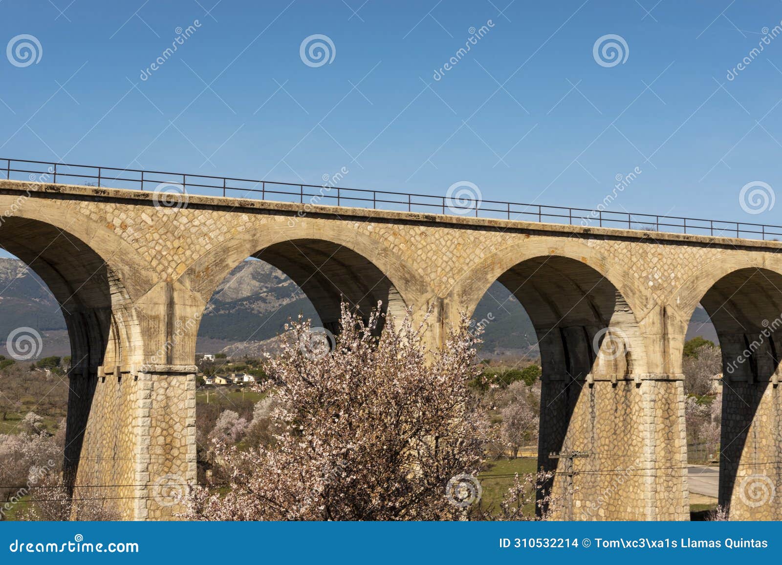 A Stone Bridge with Semicircular Arches with Train Tracks on the Deck ...