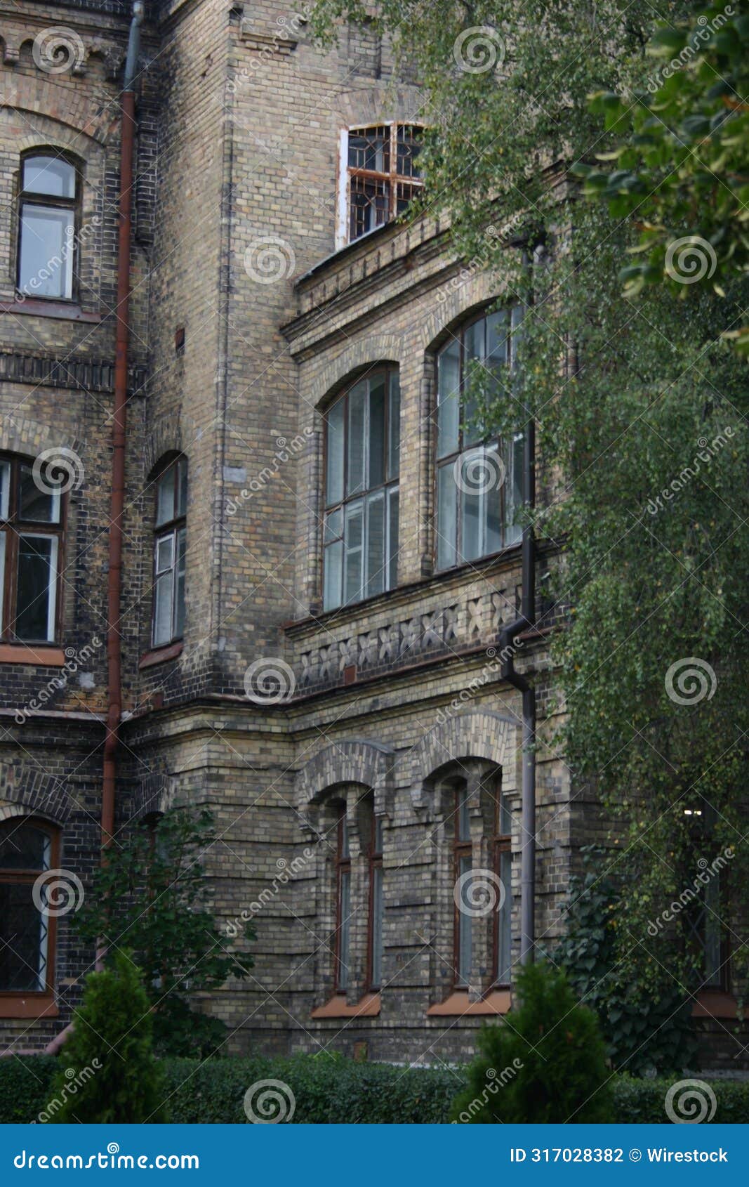 Stone Building with a Central Clock Stock Photo - Image of architecture ...