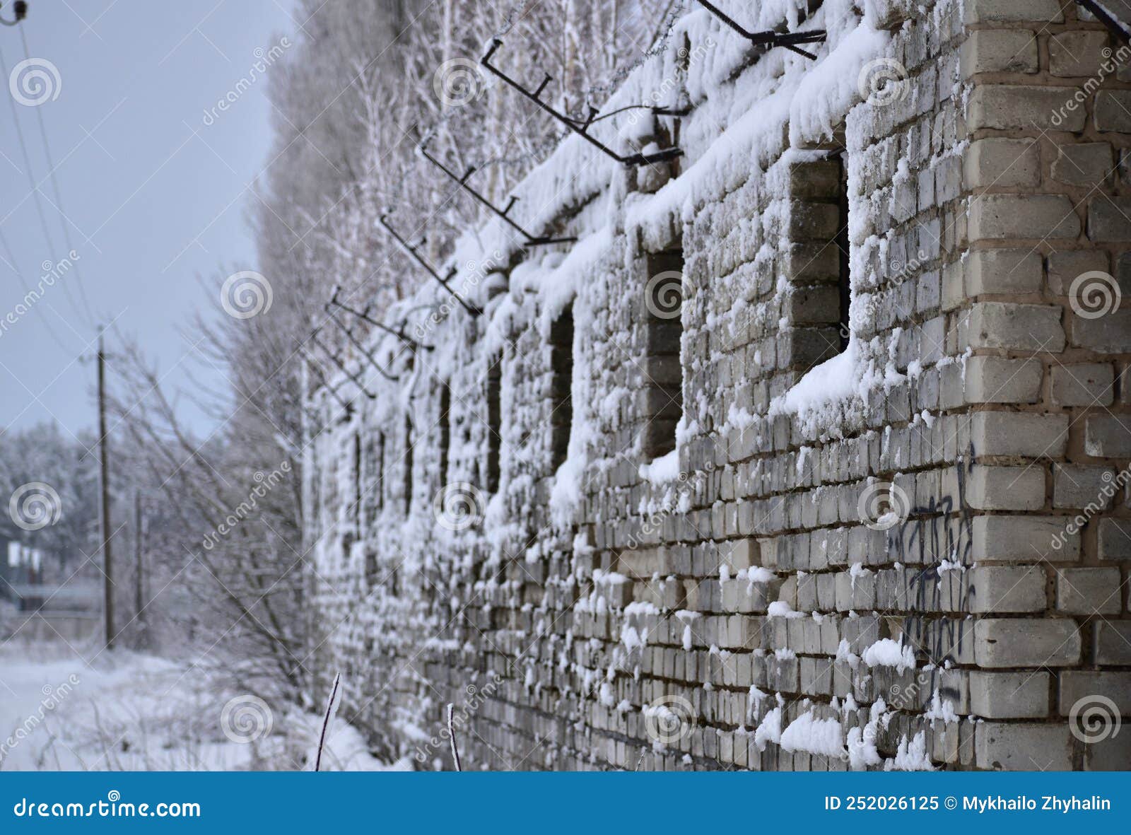 A Stone Building Whose Walls are Covered with Snow. Stock Image - Image ...