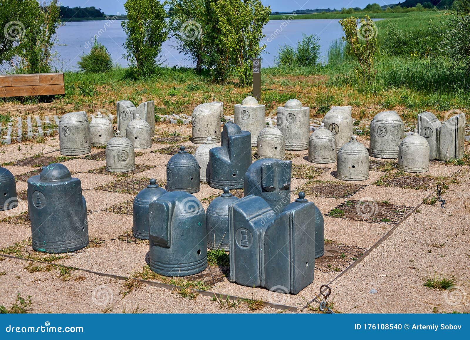 Stone Chess Pieces on the Ground. Stylized Chess Board with Stone Chess ...