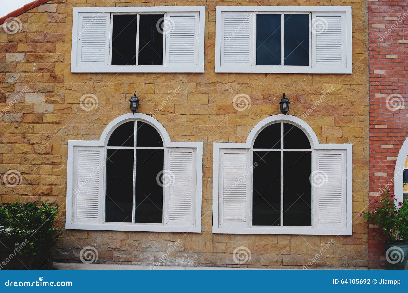 Stone Cladding Plates on the Wall with Four Window Stock Photo - Image ...