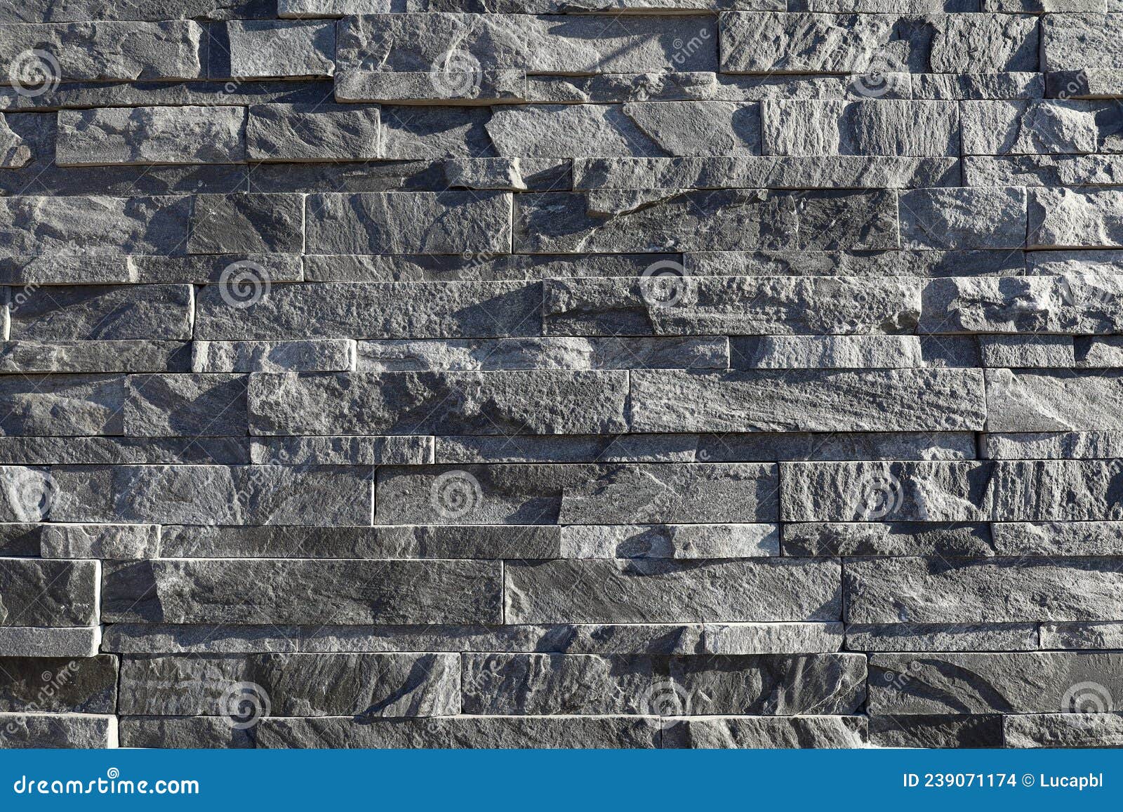 Stone Cladding Wall Made of Irregular Stacked Bricks of Gray and Black ...
