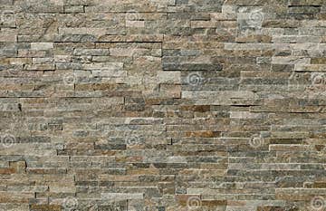 Stone Cladding Wall Made of Striped Stacked Bricks of Multicolor Rocks ...