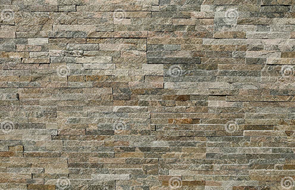 Stone Cladding Wall Made of Striped Stacked Bricks of Multicolor Rocks ...