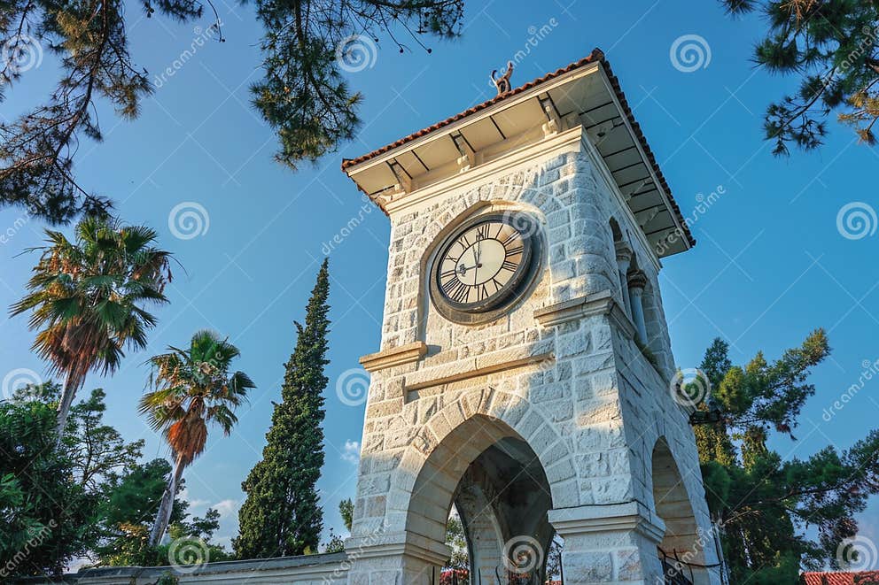 A Stone Clock Tower with a Clock on Its Face, Great for Use in Historic ...