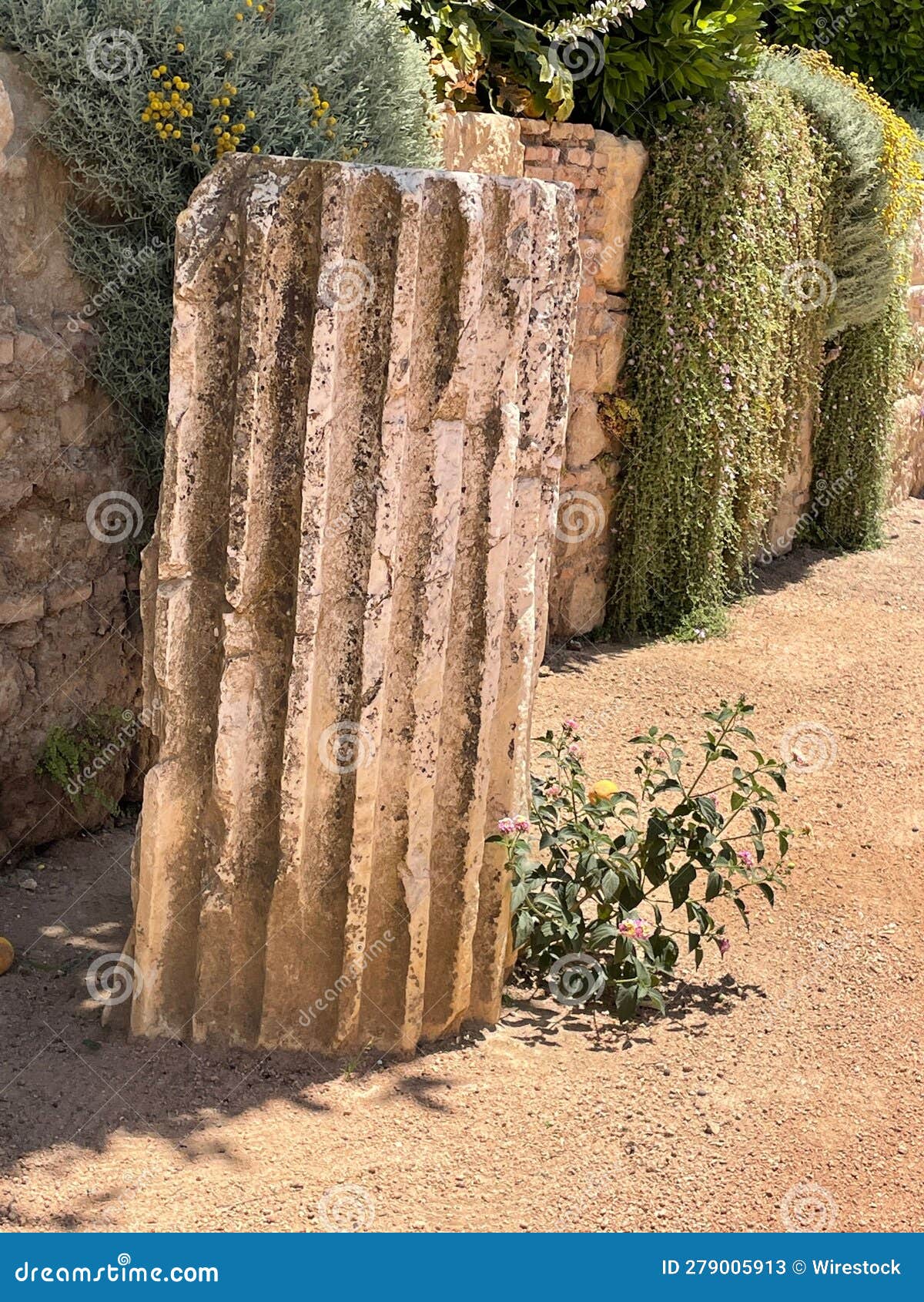 Stone Column Detailed with Stripes and Falling Bushes Behind. Stock ...