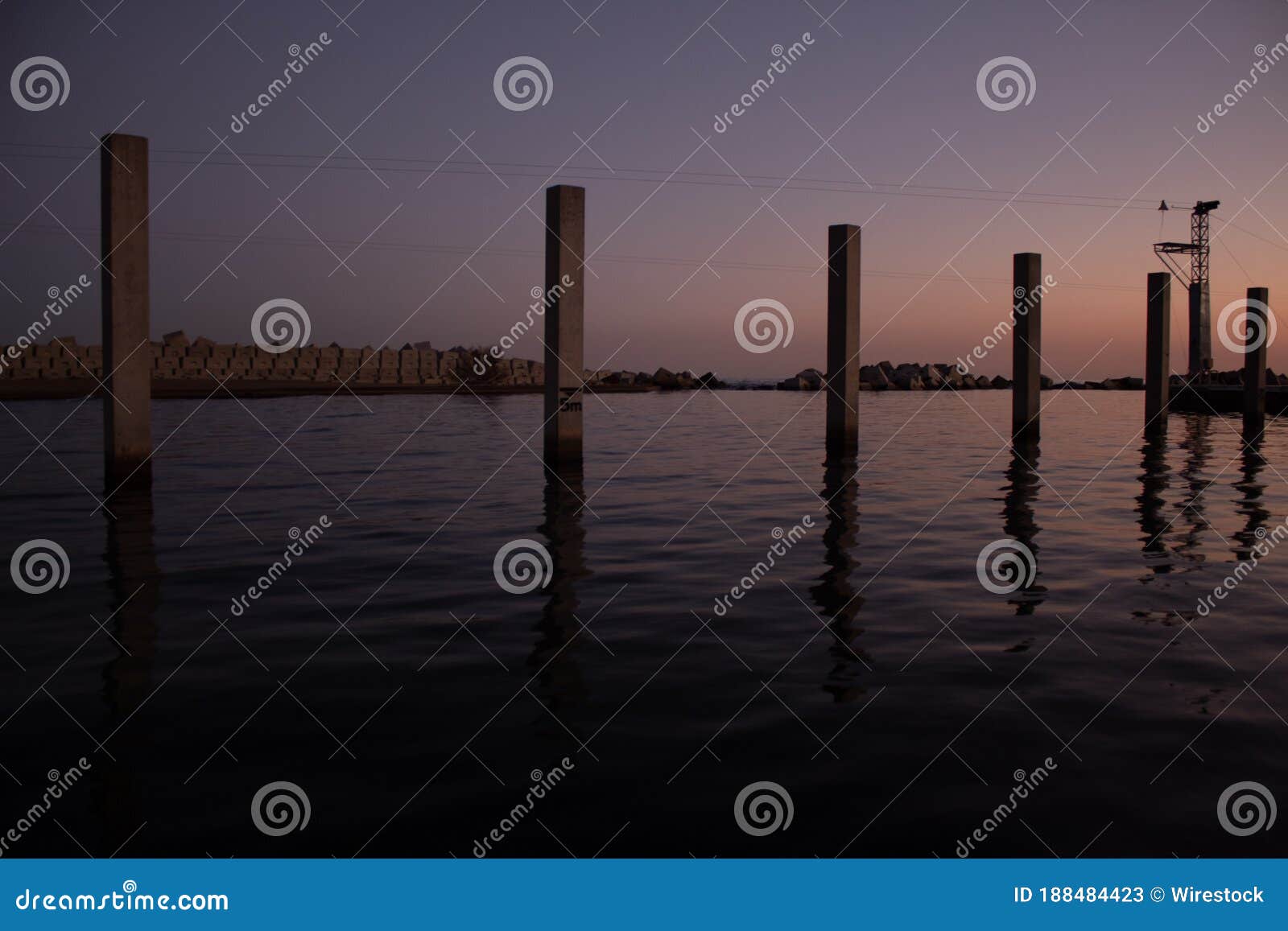 Stone Columns in the Water during the Sunset Stock Image - Image of ...