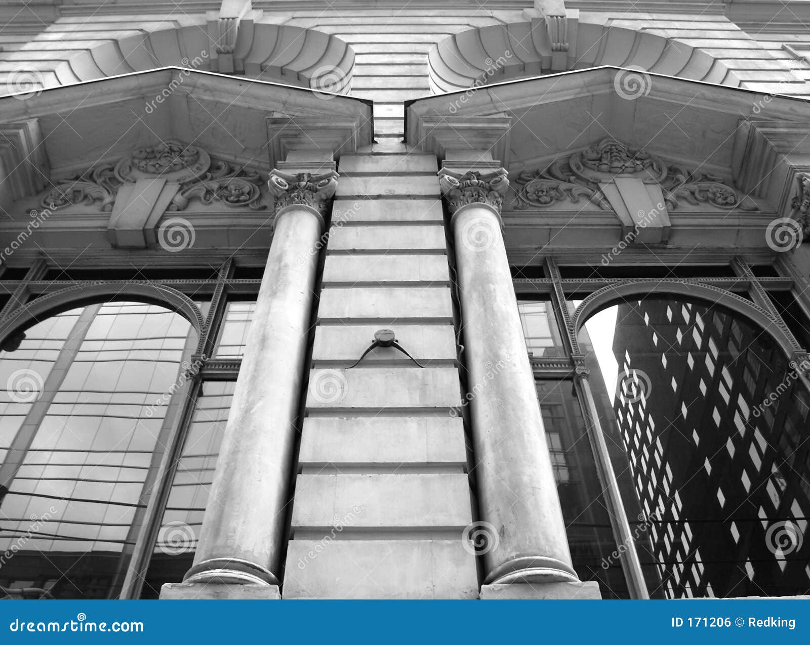 Stone Columns with Windows that Reflect the City Stock Photo - Image of ...