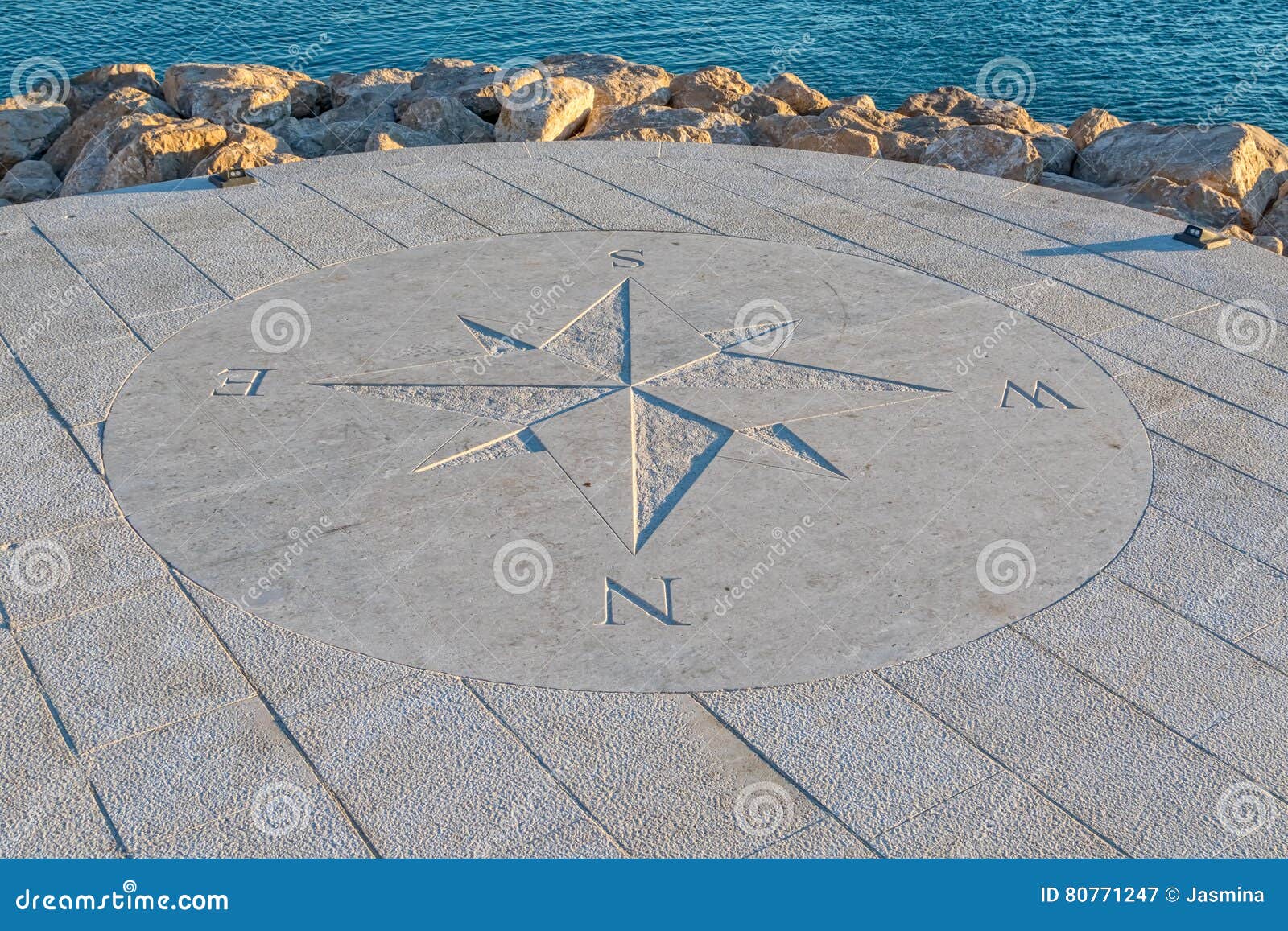 Stone Compass Rose Set Within A Star. Golden Coloured Paving Slabs ...