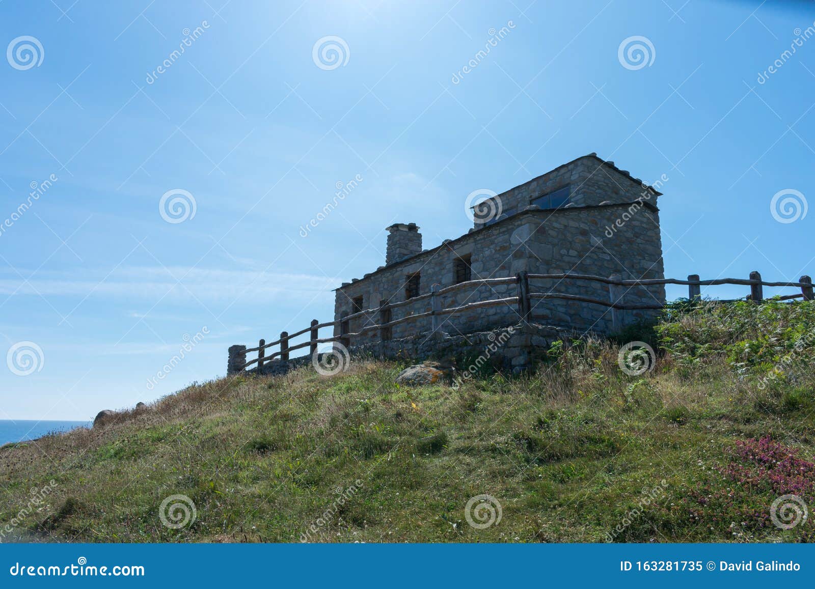 Stone Construction on Cliff Next To the Ocean Stock Image - Image of ...