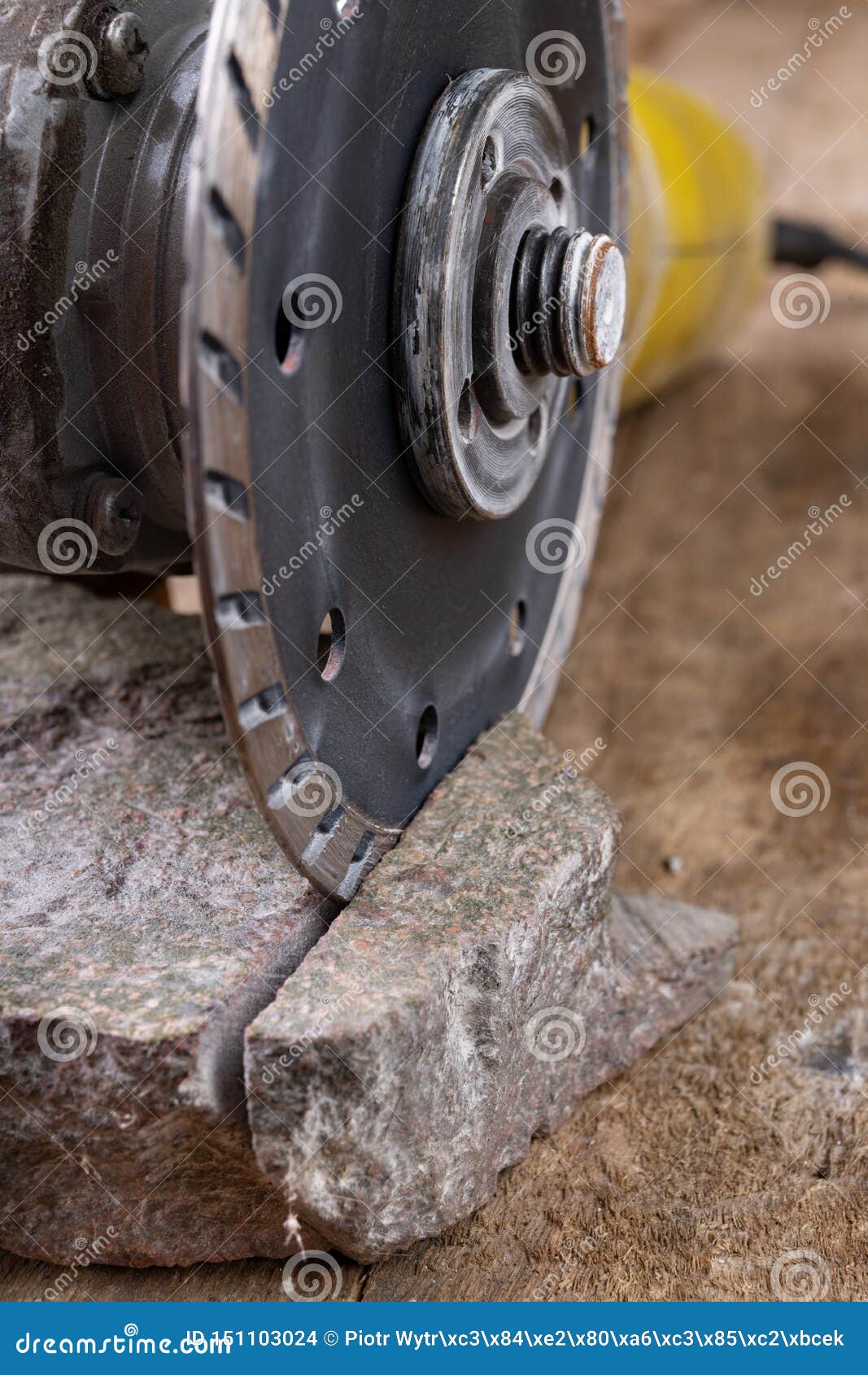 Stone Cutting with a Diamond Disc Mounted in a Grinder. Work in a Stone ...