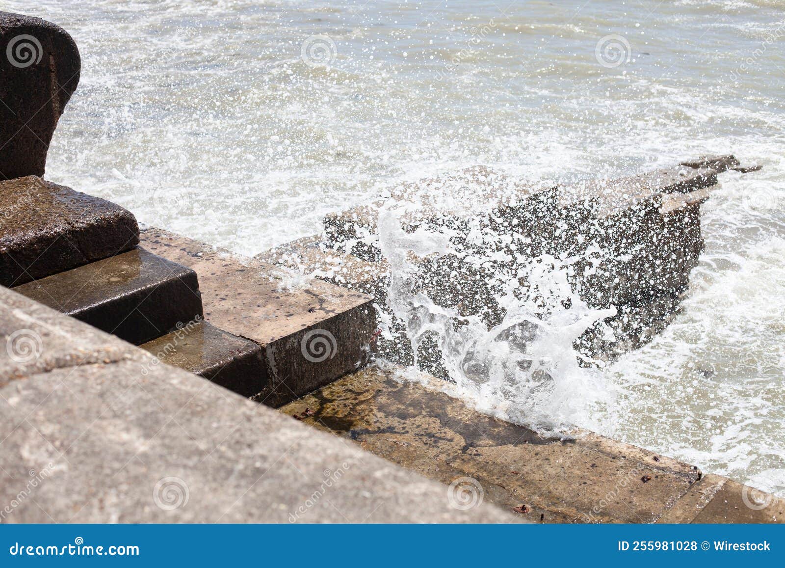 Stone Edge of a Fountain with Water Splashing Stock Photo - Image of ...