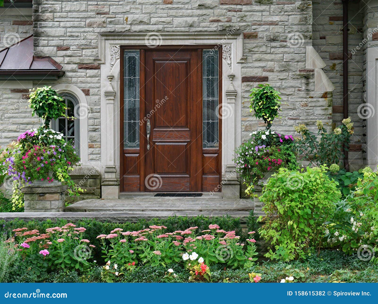 Stone Faced House with Flower Garden and Elegant Wooden Front Door ... Stone Faced House with Flower Garden and Elegant Wooden Front Door ...