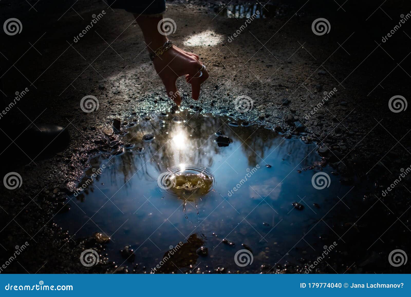 Stone,falling into a Puddle,freezed in the Moment. Stock Photo - Image ...