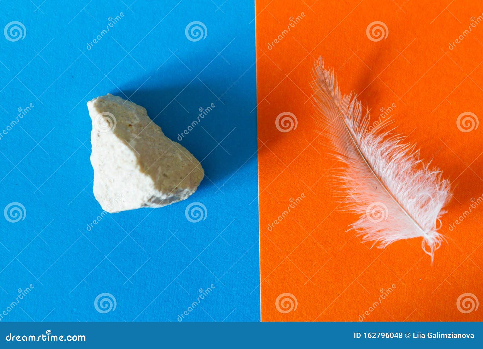 Stone and feather stock photo. Image of conceptual, feelings - 162796048