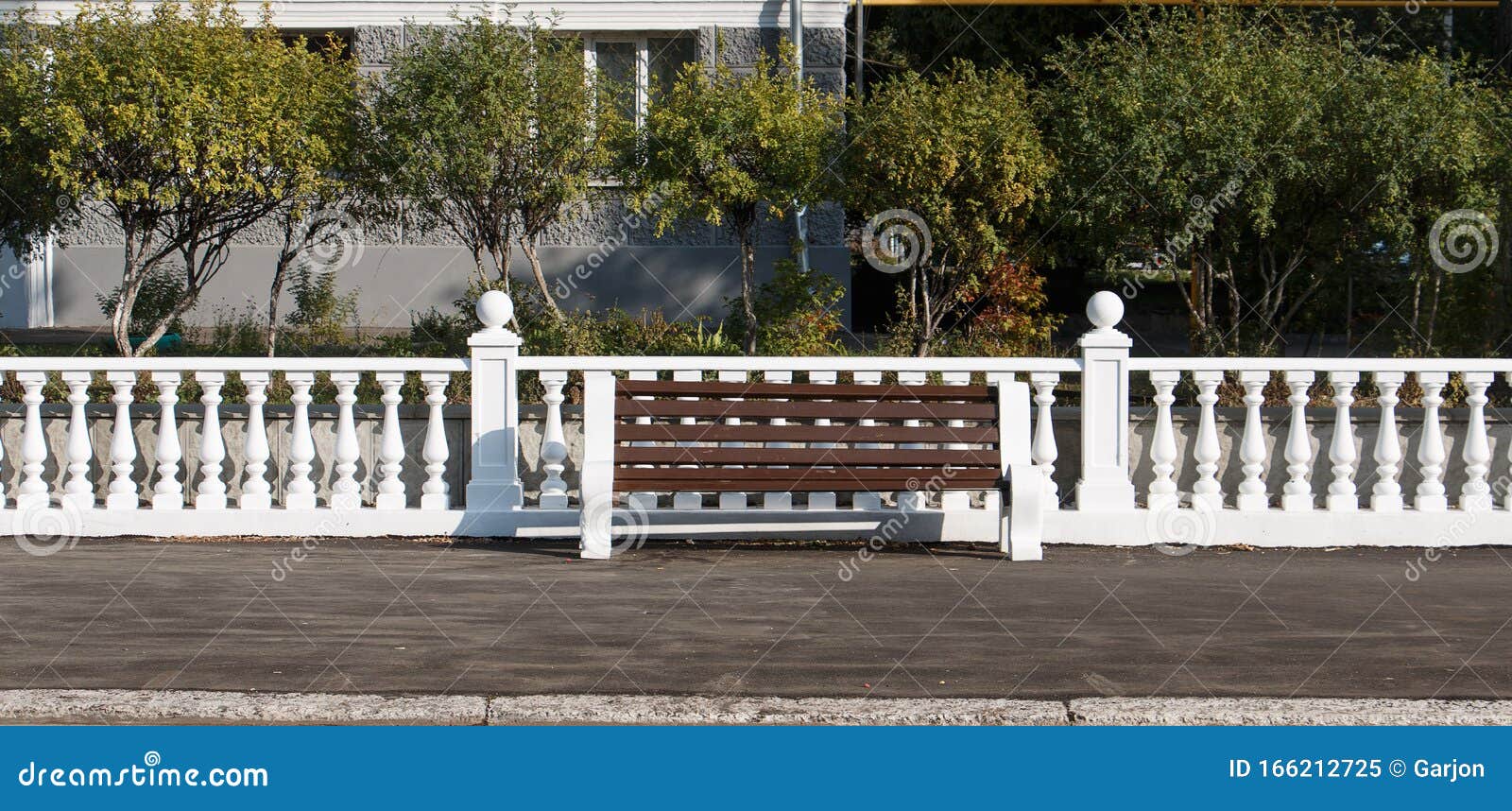 Stone Fence Fence with Balusters and a Bench in Front Stock Image ...