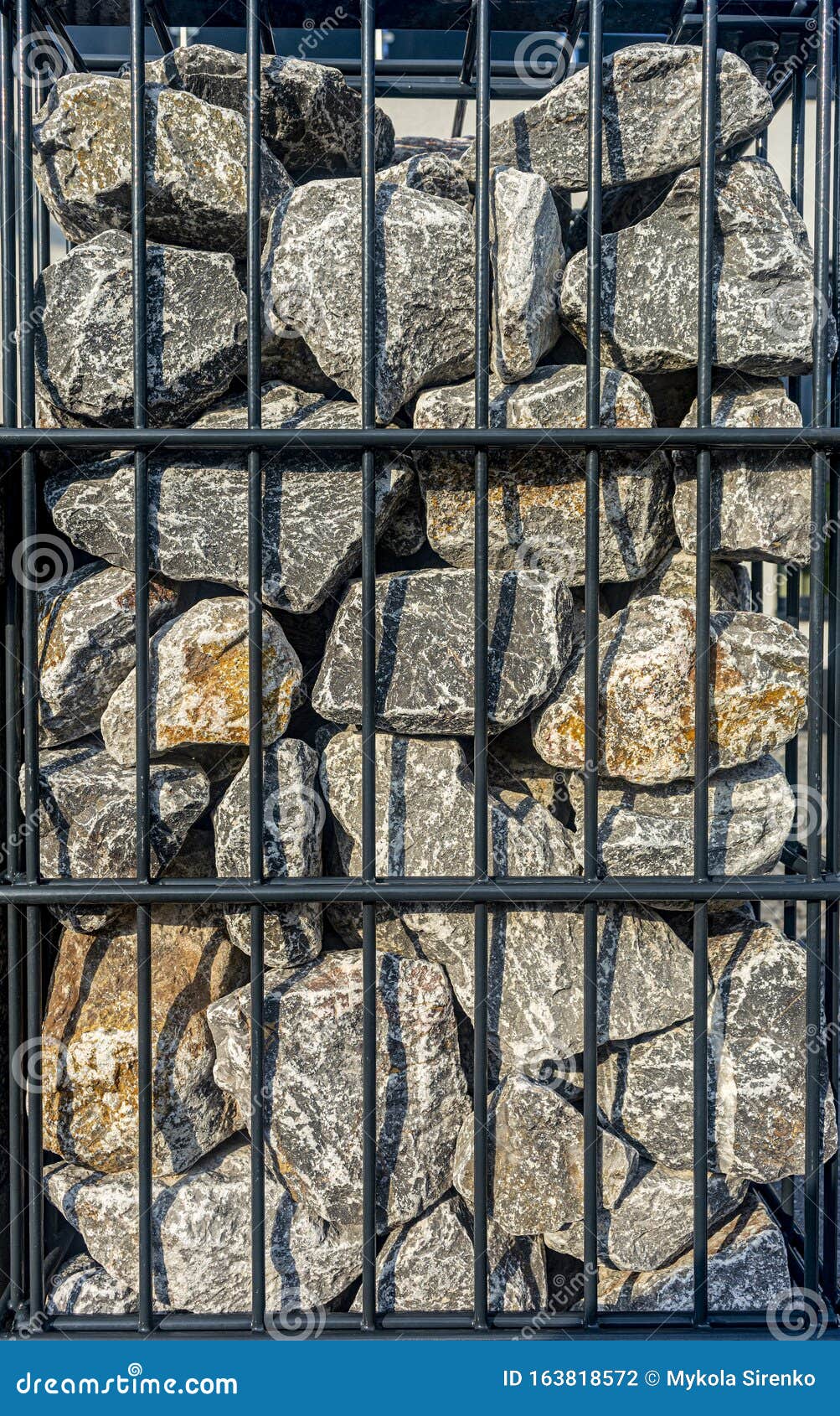 Stone Fence, Iron Mesh, Large Stones for the Fence Closeup Stock Photo ...