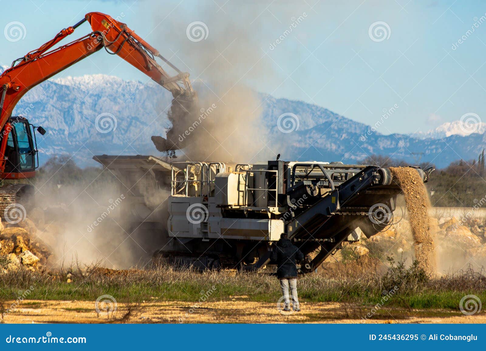 Stone Filled Rock Crusher with Stone Crusher and Bucket Editorial Image ...