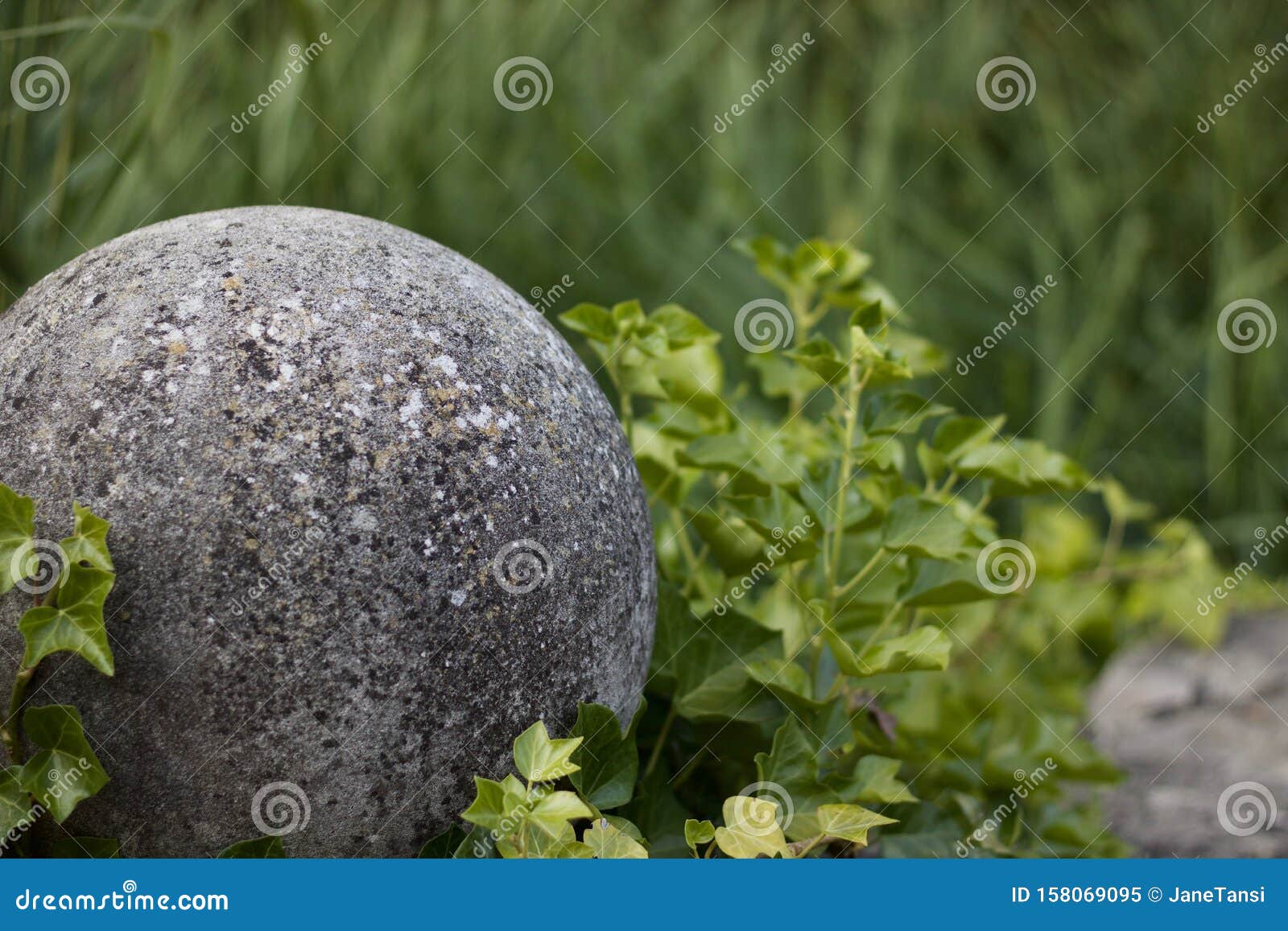 Stone Garden Globe or Sphere with Foliage To Side Stock Image - Image ...
