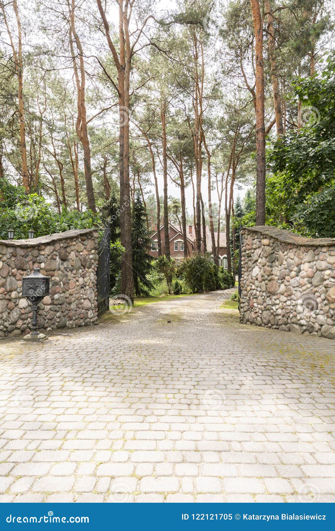 Stone Gate and Driveway into Forest with Residence. Real Photo Stock ...