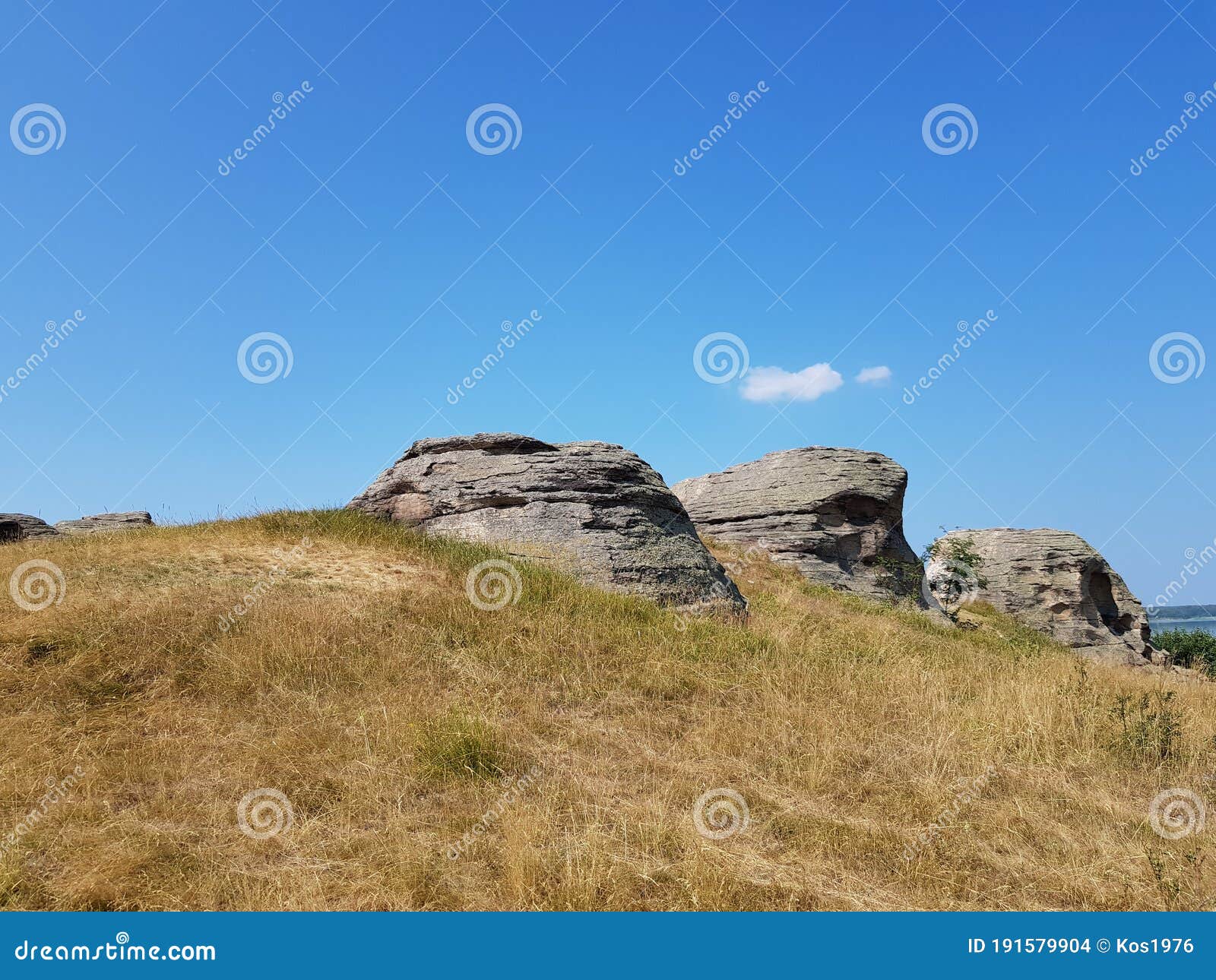Stone Granite Rock in the Steppe Stock Photo - Image of grass, cliff ...