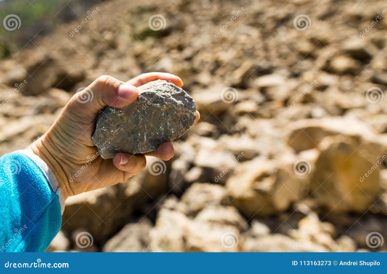 Stone in Hand in the Mountains Stock Image - Image of hand, white ...