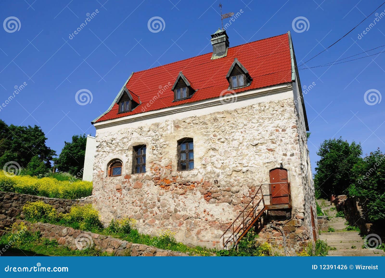 Stone House with Red Roof stock photo. Image of door - 12391426