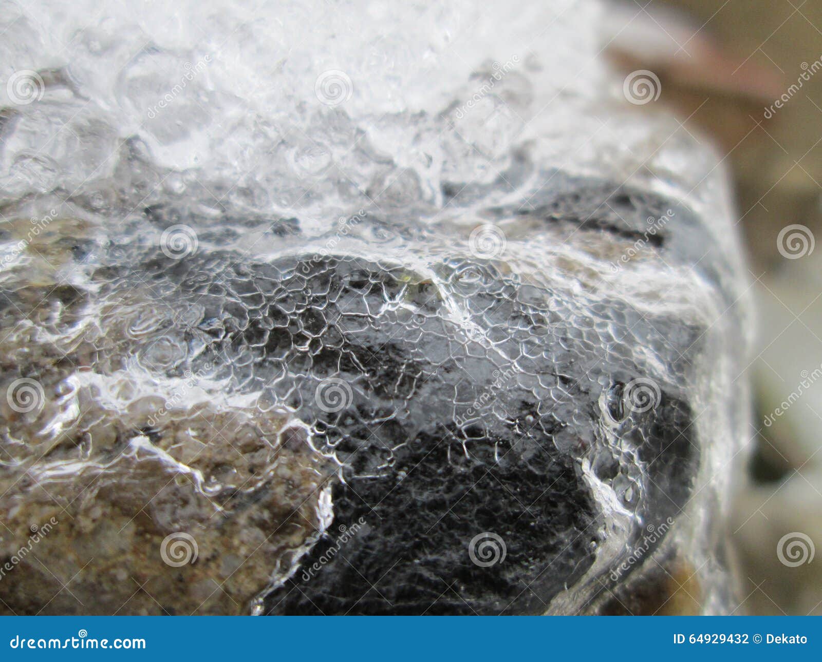 Stone in ice rind stock photo. Image of nature, cold - 64929432