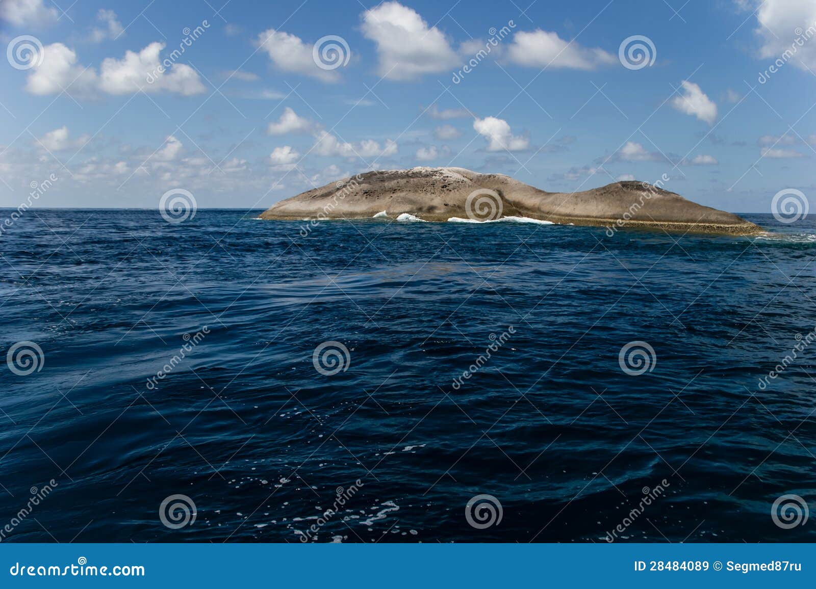 A stone island in the sea stock image. Image of lagoon - 28484089
