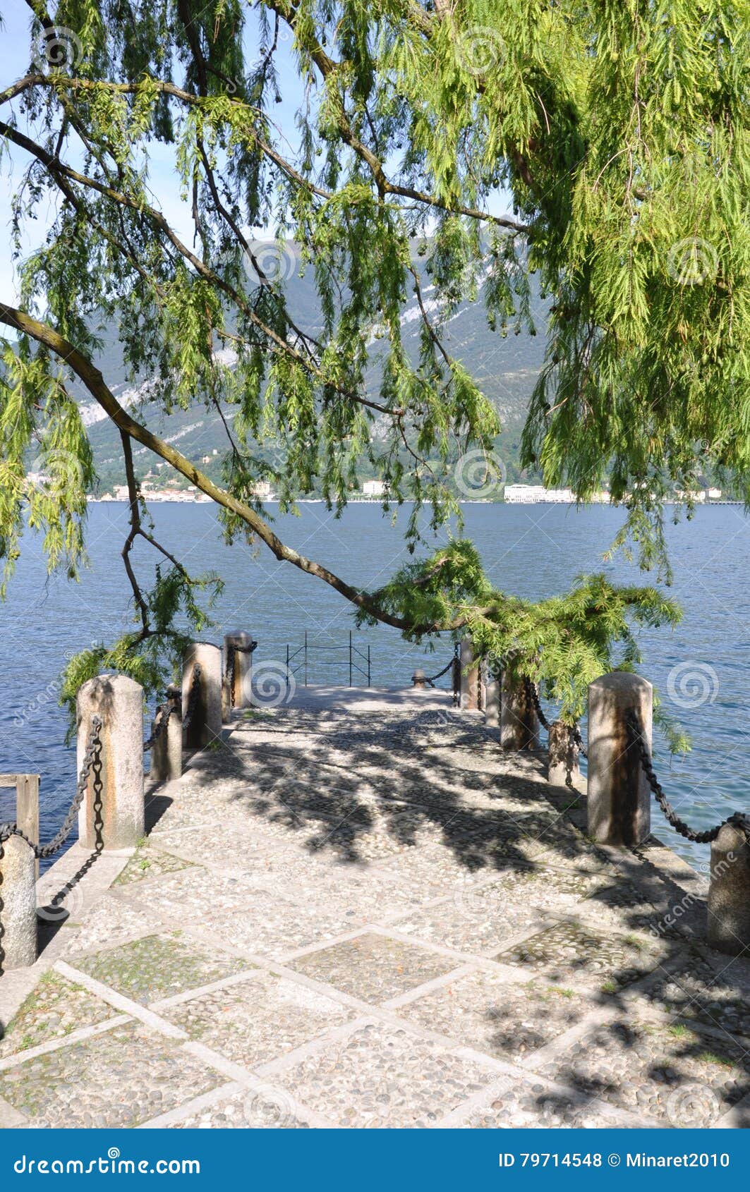 Stone jetty at Lake Como stock photo. Image of peaceful - 79714548