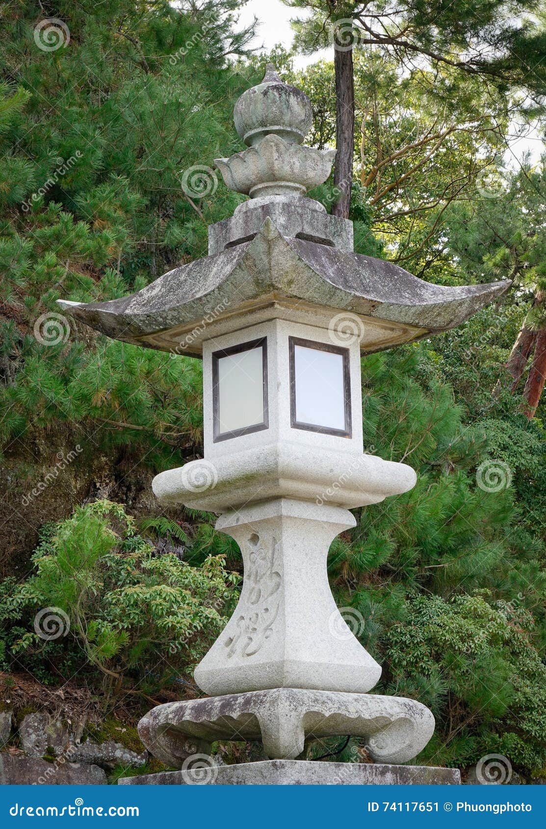 A Stone Lantern at Itsukushima Shrine in Hiroshima, Japan Stock Image ...