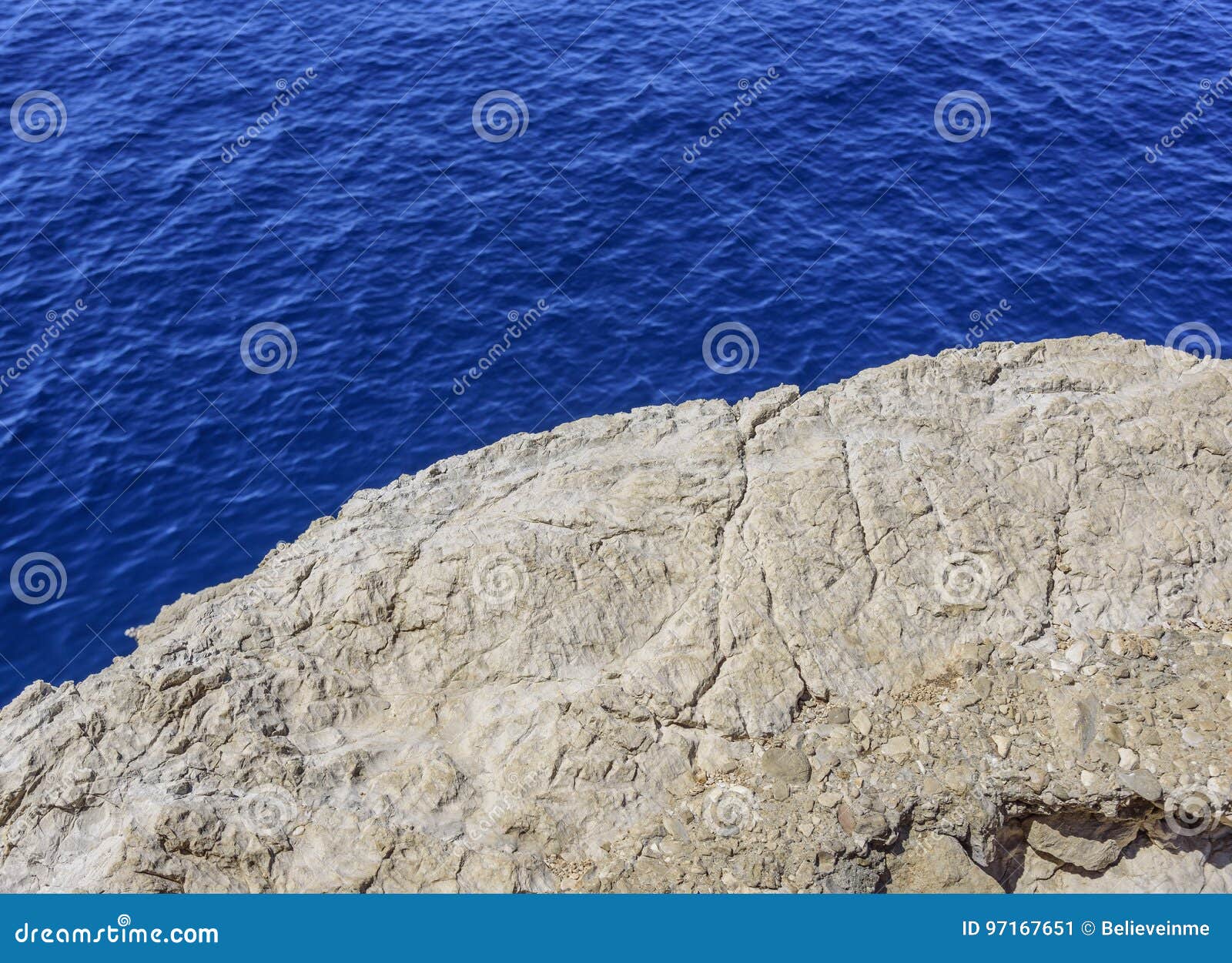 Stone ledge above the sea. stock image. Image of beautiful - 97167651