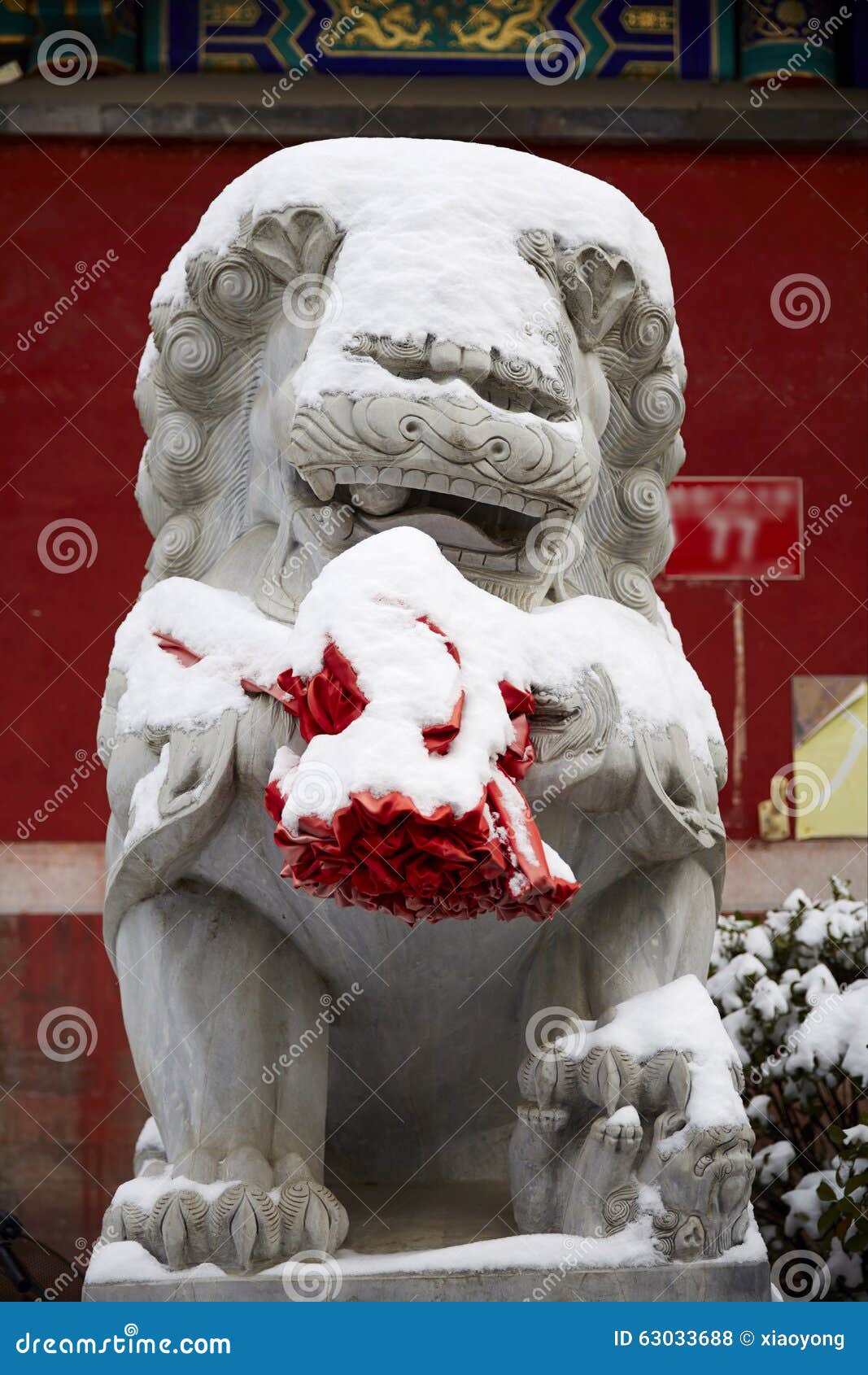 Stone lion statue in snow stock photo. Image of statue - 63033688