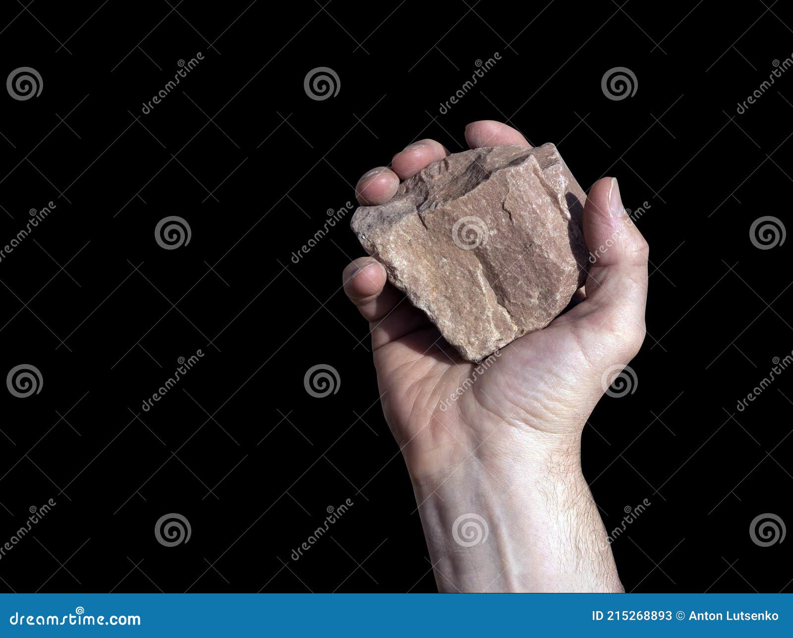 Stone in a Mans Hand on Black Background Stock Image - Image of city ...