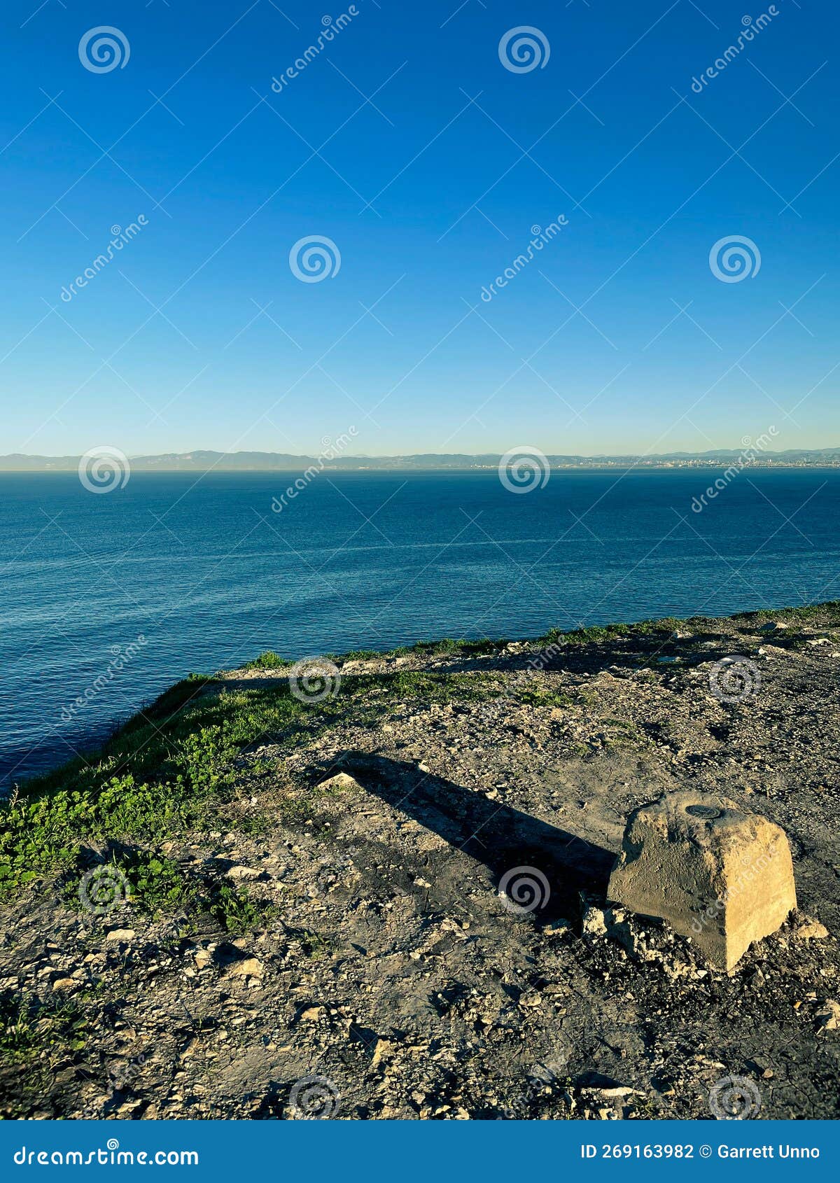 Stone Marker Casting Shadow on Ocean Front Bluff Stock Photo - Image of ...