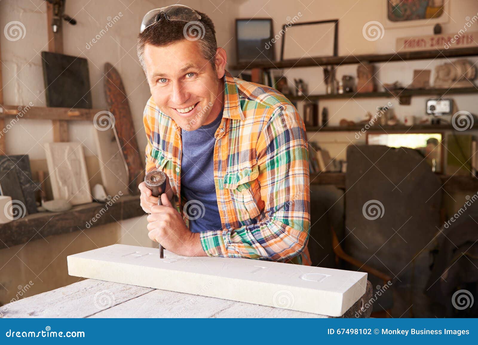 Stone Mason at Work on Carving in Studio Stock Photo - Image of people ...