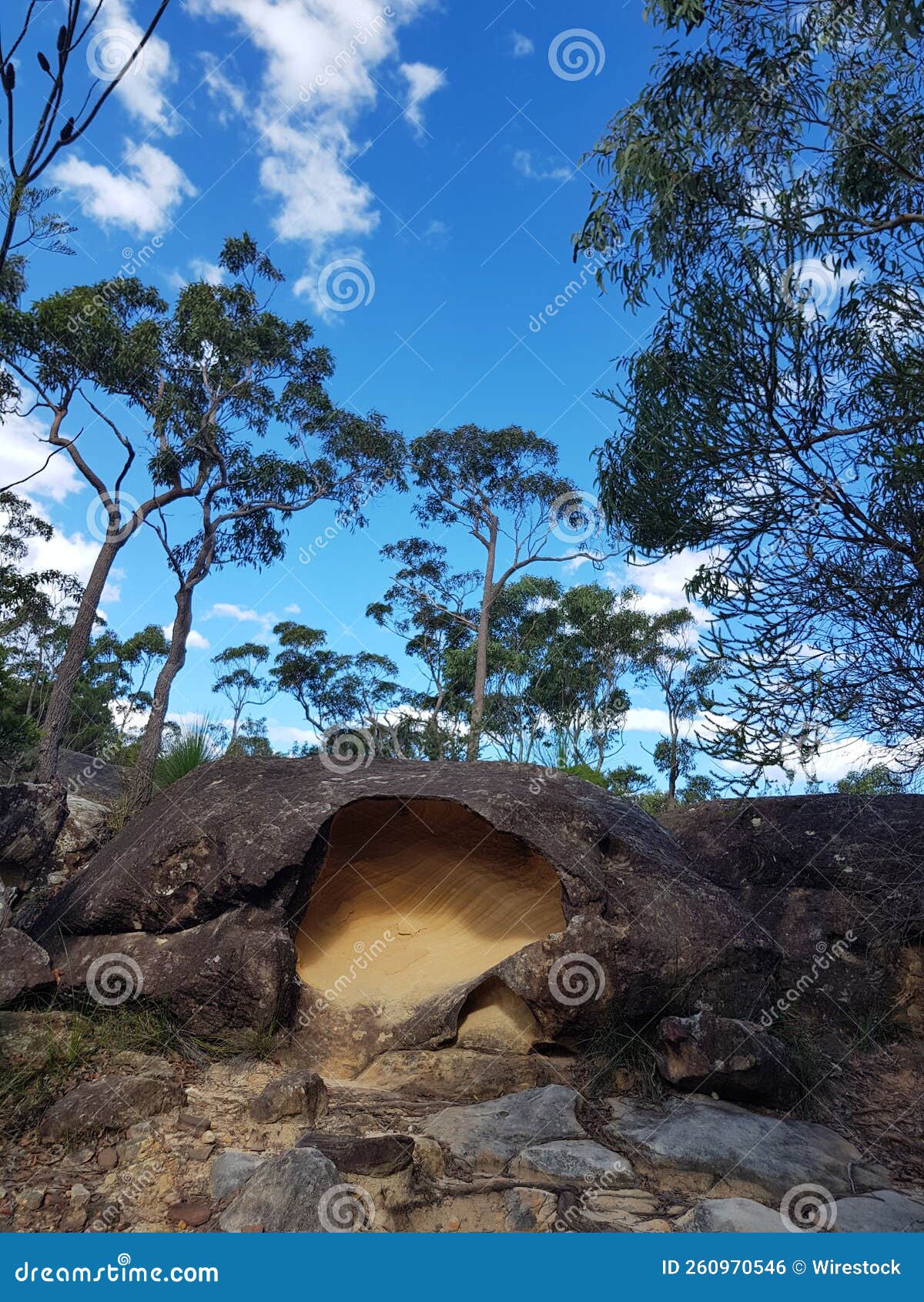Stone Medieval Cave Under Trees and Blue Sky in Australia, Vertical ...