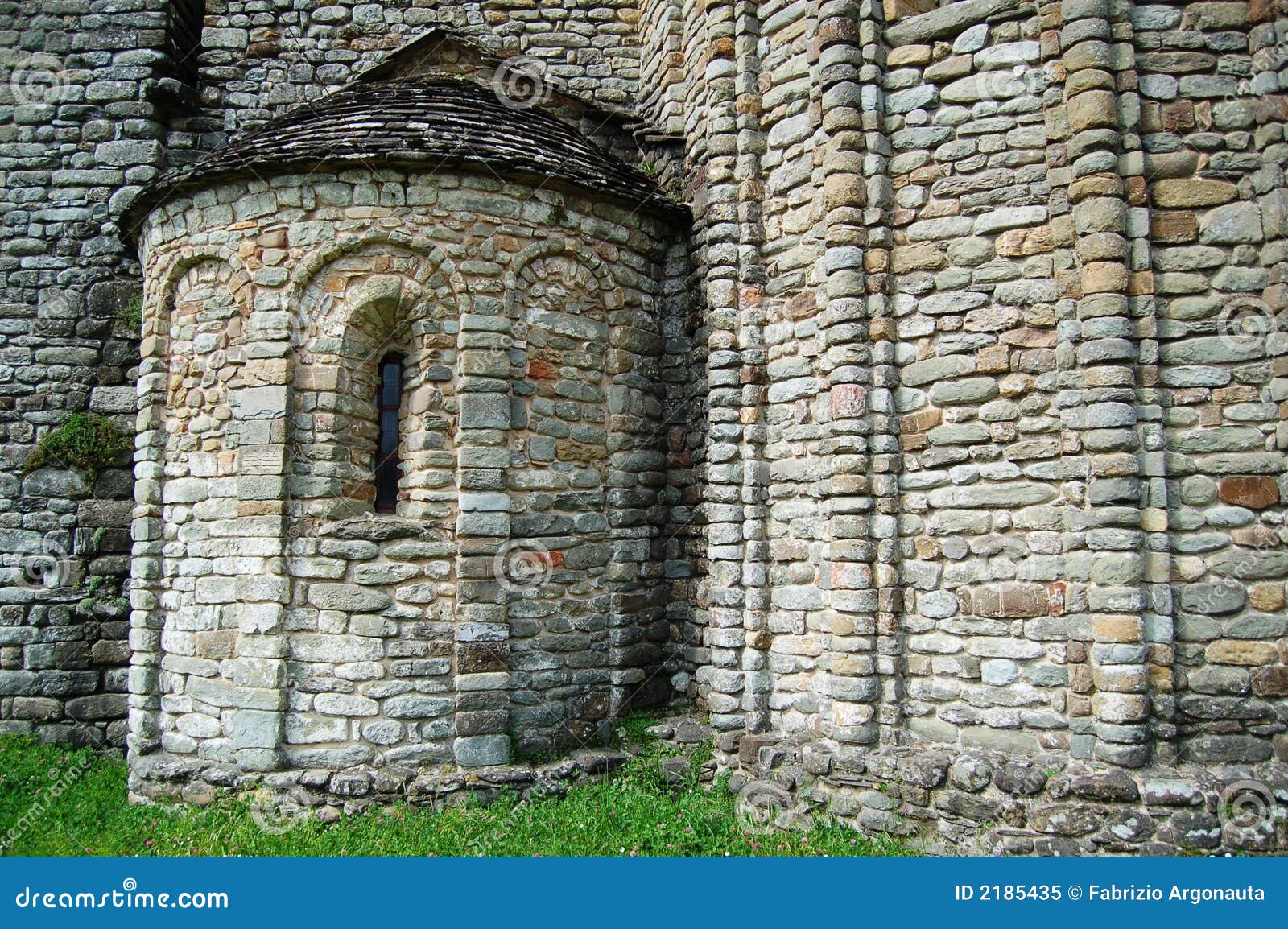 Stone Medieval Fortress Wall With Green Roofs, Showcasing Historic ...