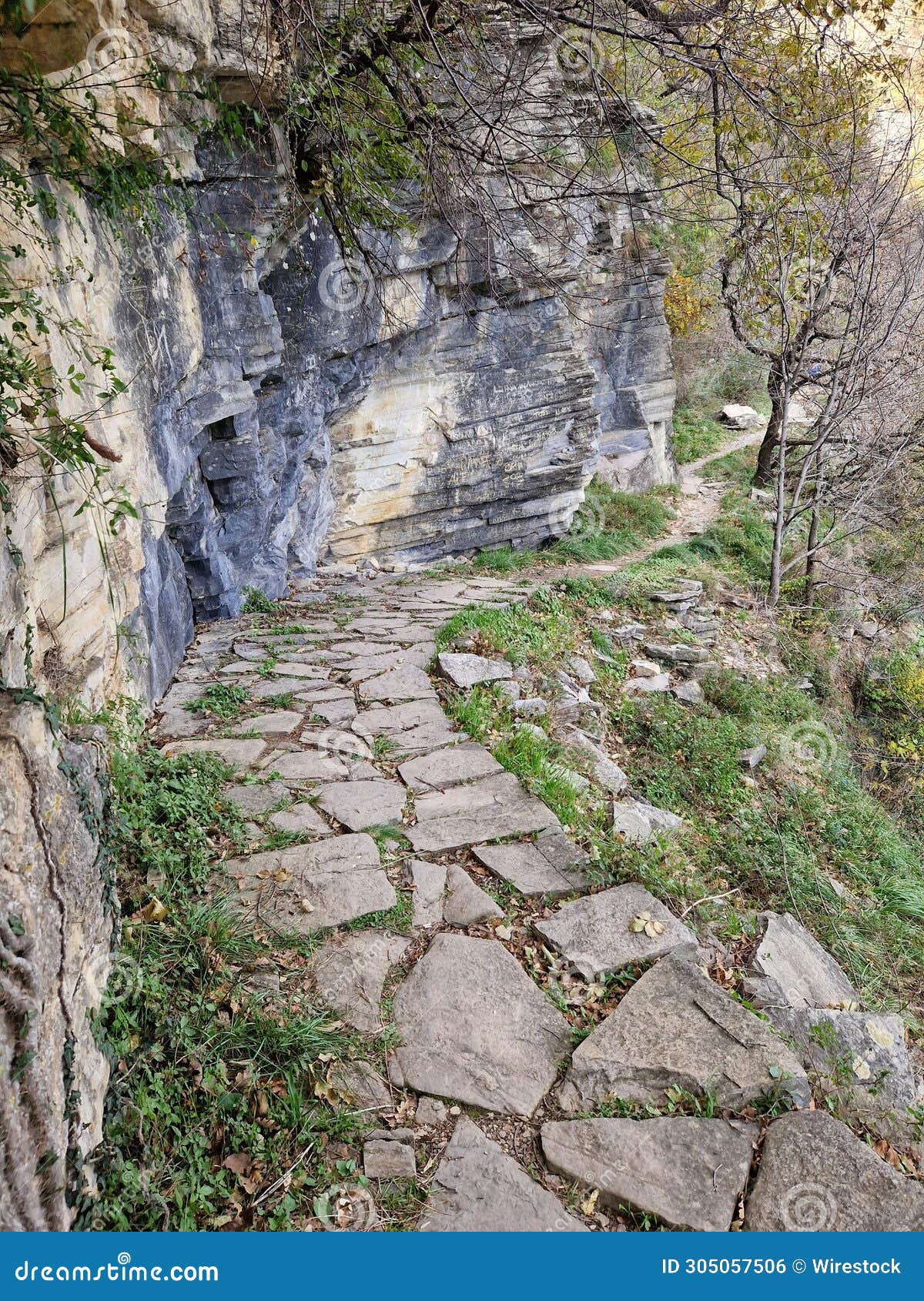 A Stone Path Cuts through the Side of a Large Hill Stock Photo - Image ...