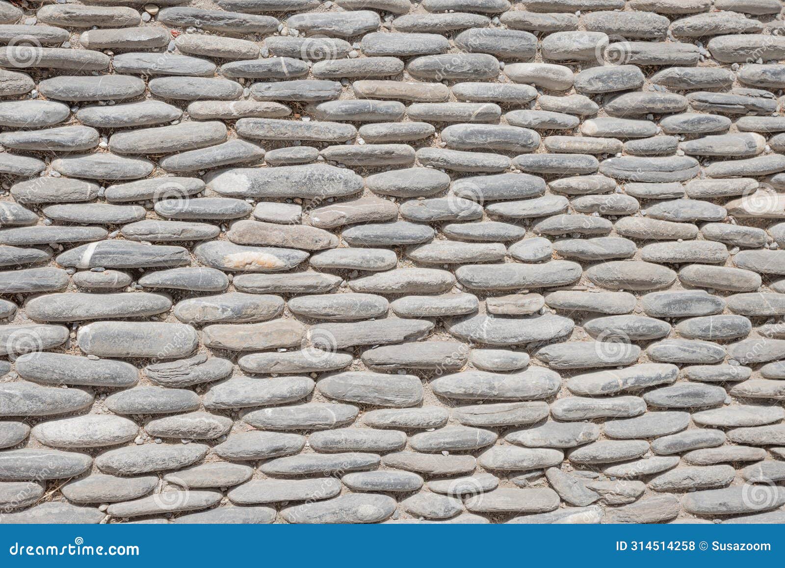 Stone Pavement with Rounded Blocks and Soil between Stock Photo - Image ...