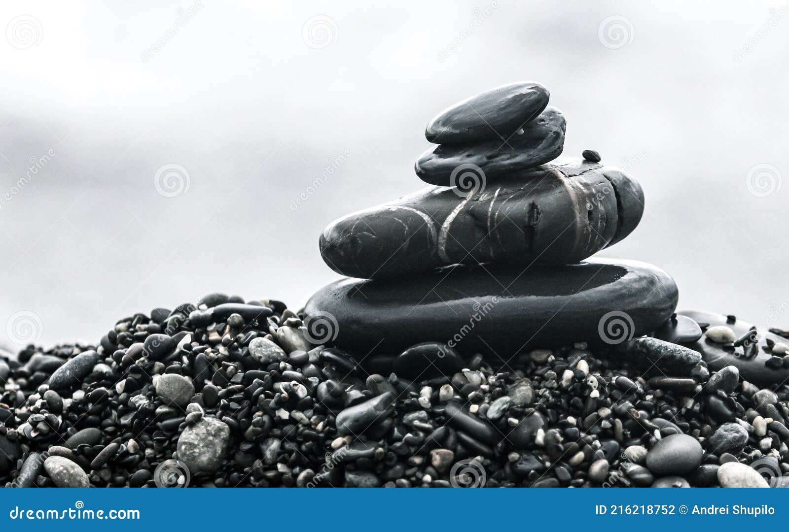 Stone pebbles by the sea stock photo. Image of balance - 216218752