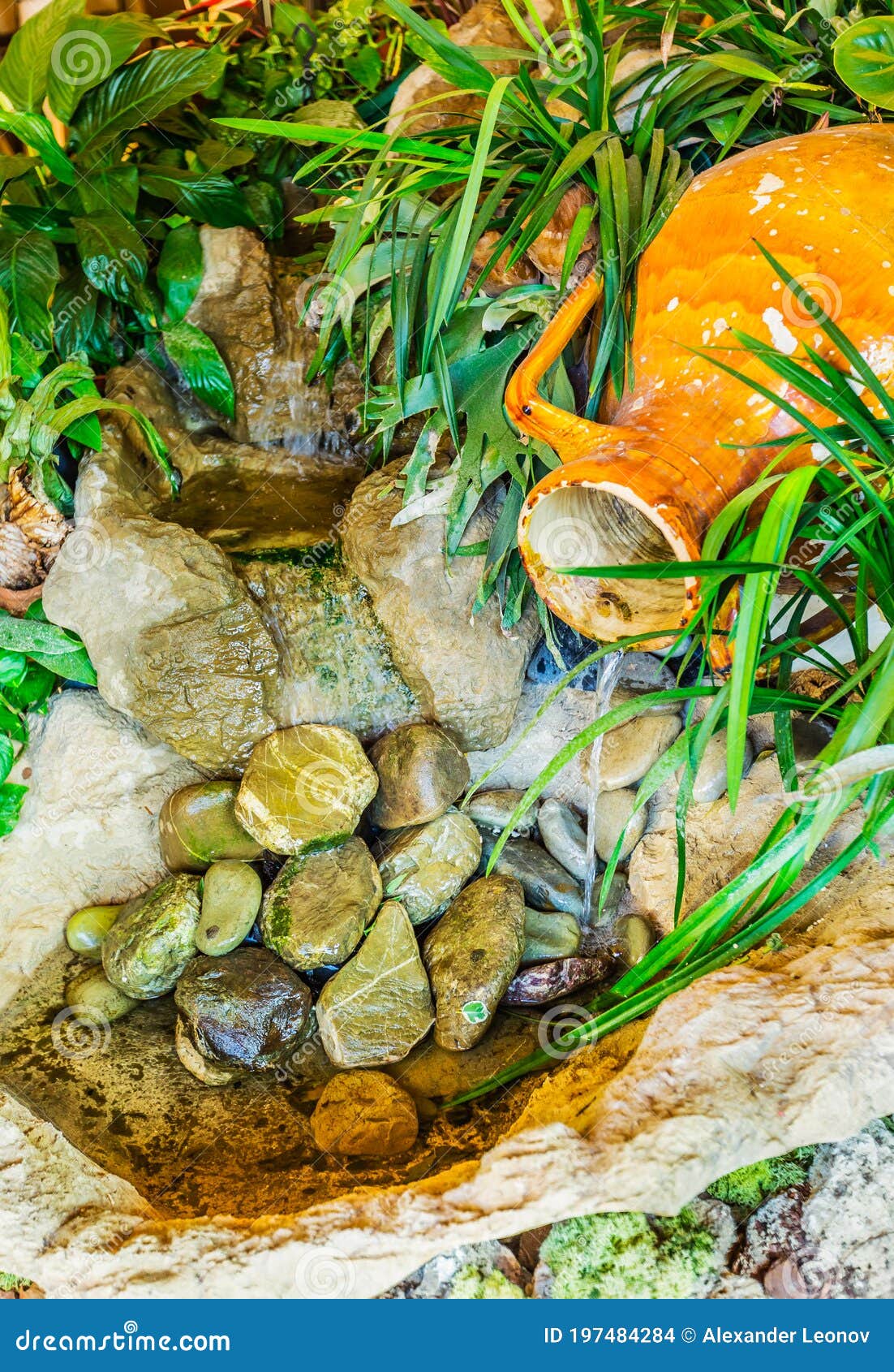 Stone pitcher of water stock photo. Image of waterfall - 197484284