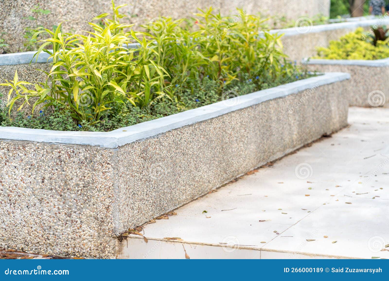A Stone Pot With A Wall Structure That Grows Some Plants On It At A A ...